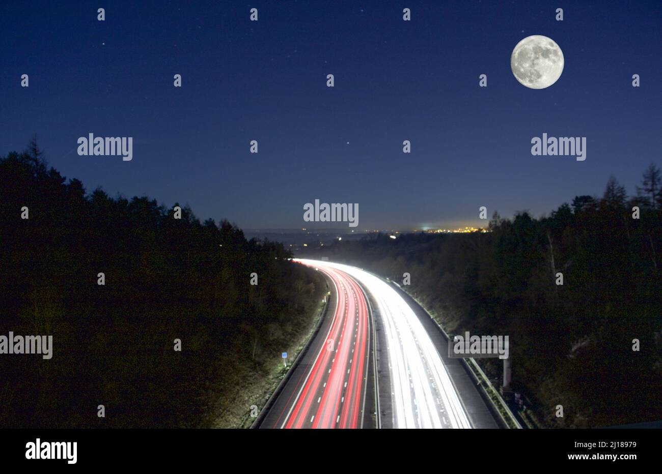 A Traffic lines an night city highway Stock Photo - Alamy