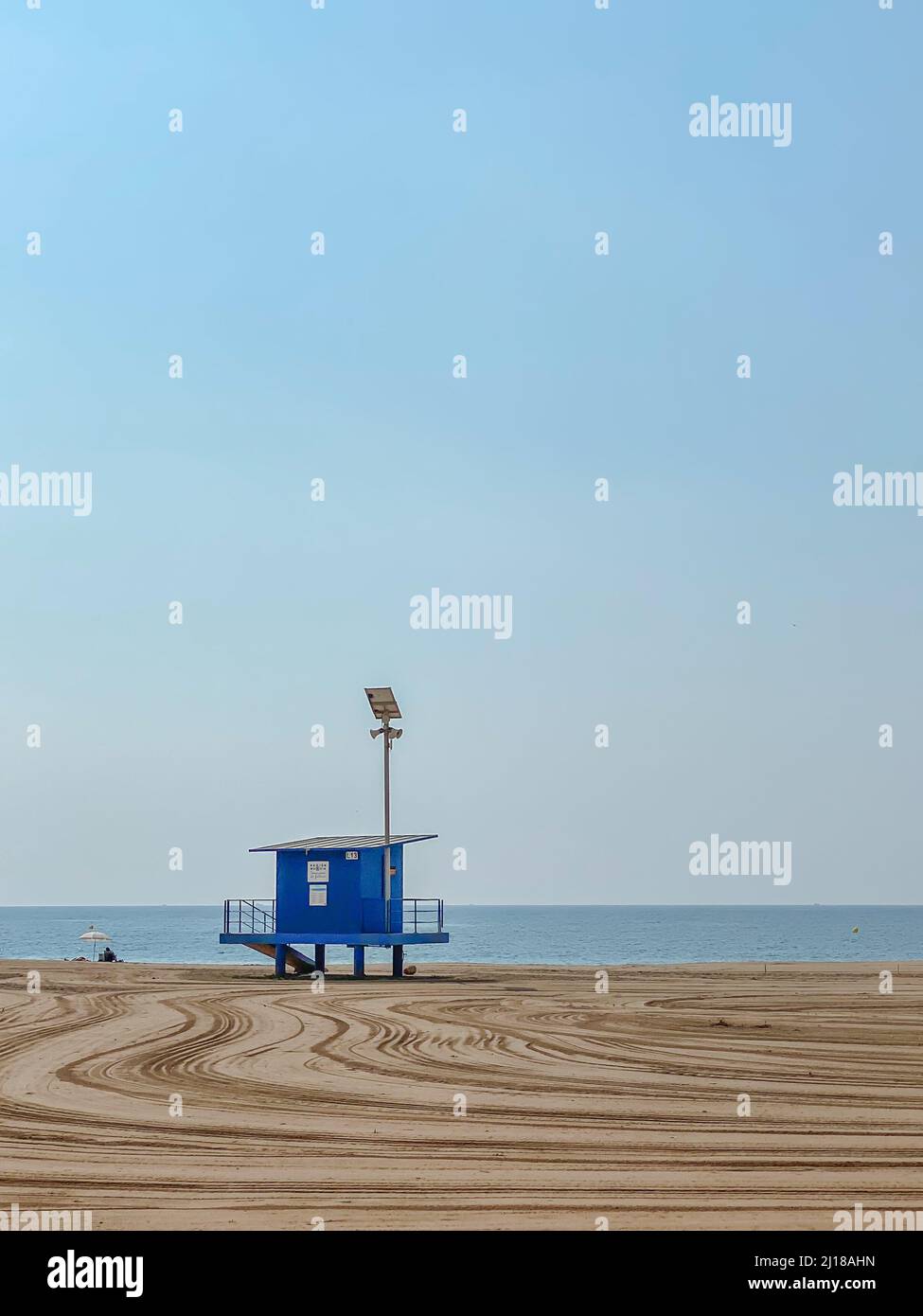A vertical shut of a blue hut on a beach Stock Photo - Alamy