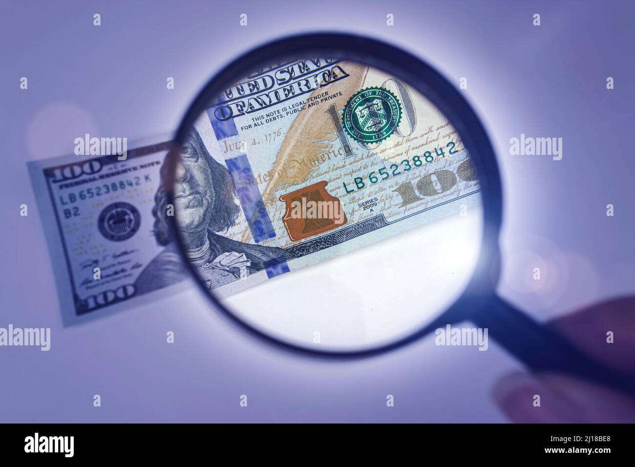 Concept on the theme of checking money for authenticity. Hand holding ...