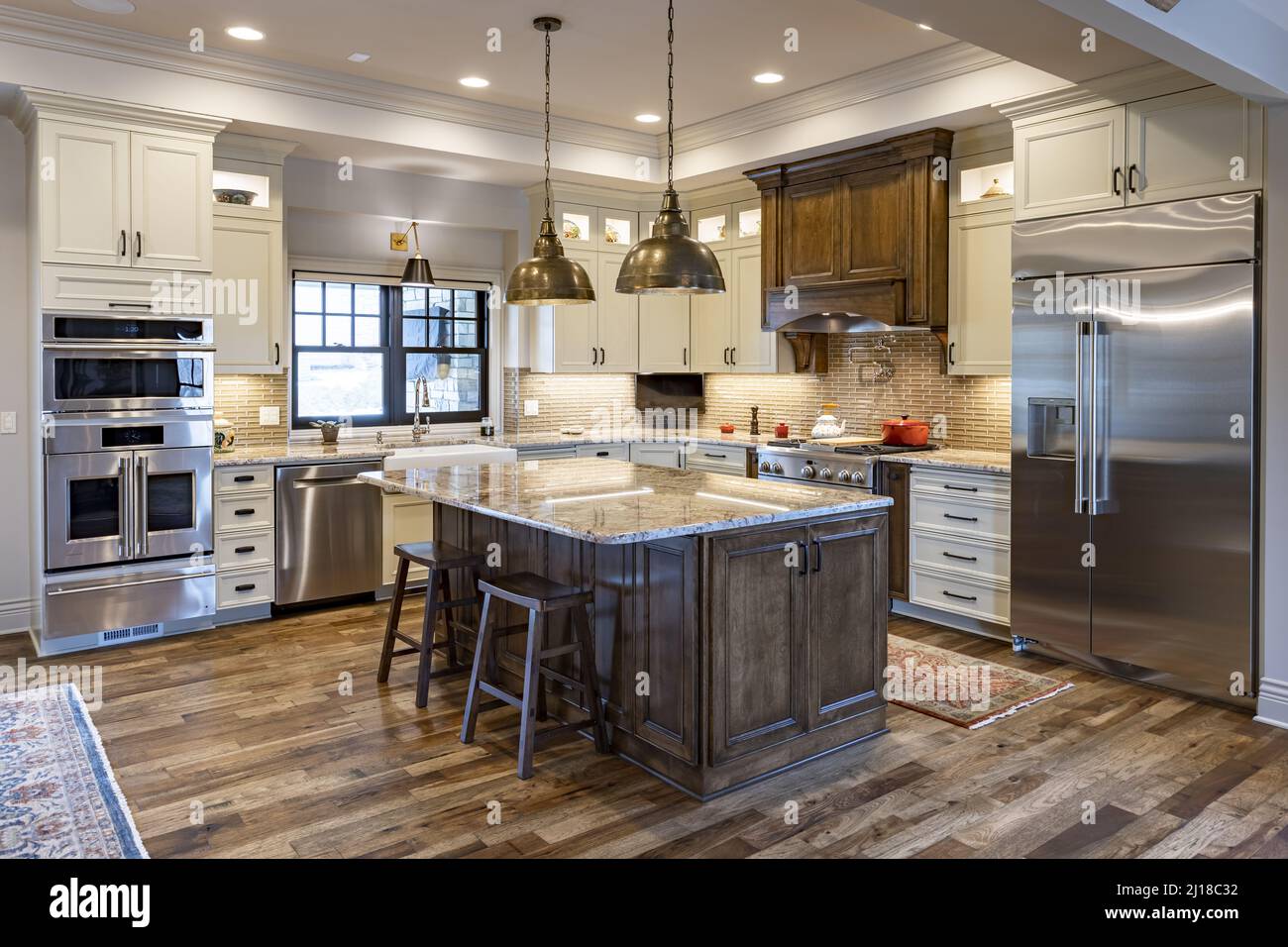 A modern rustic kitchen with an island Stock Photo - Alamy