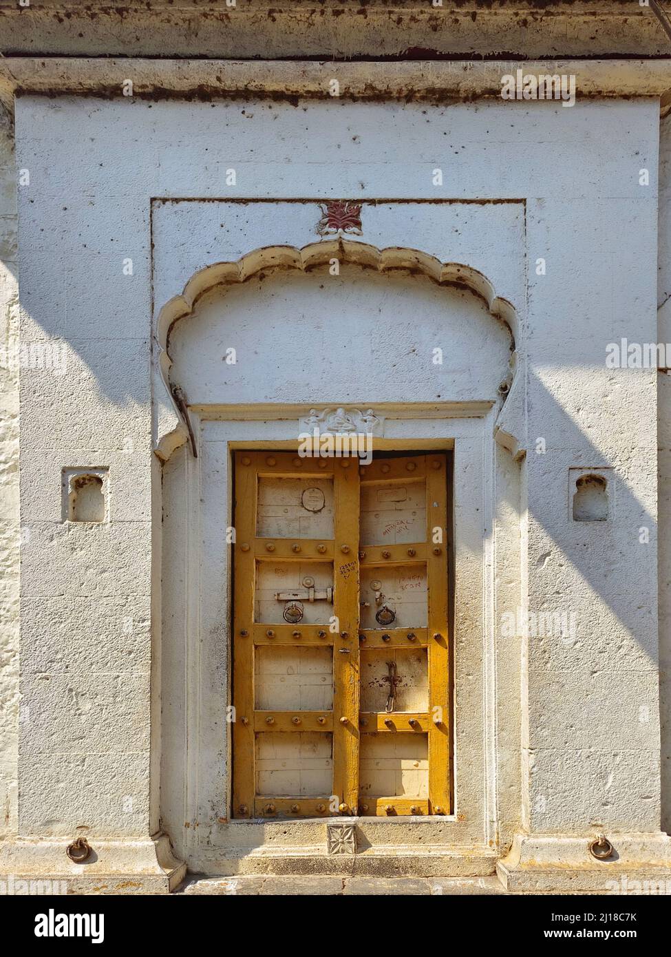 21 March 2022, Pandharpur, India, Old Vintage wooden door on retro wall ...