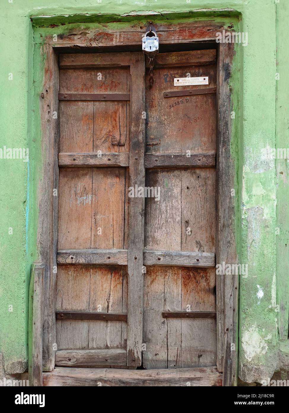 21 March 2022, Pandharpur, India, Old Vintage wooden door on retro wall ...