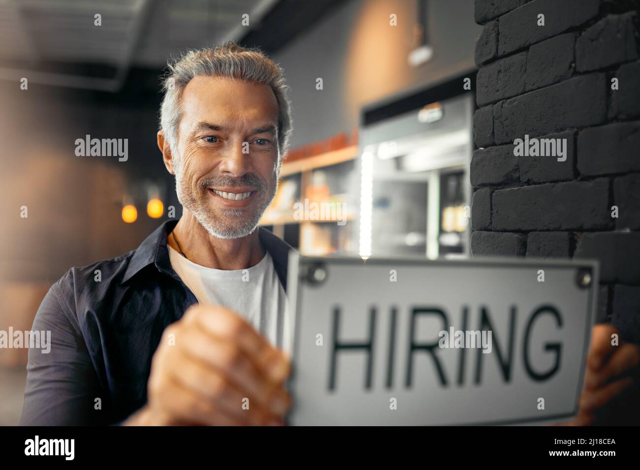 Man standing holding staff hi-res stock photography and images - Alamy