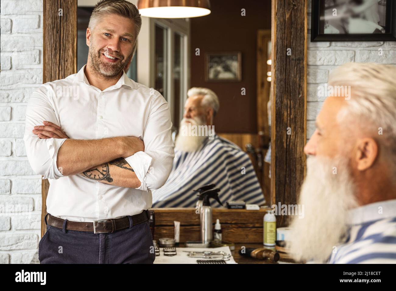 Happy hairdresser and client in the barbershop Stock Photo - Alamy