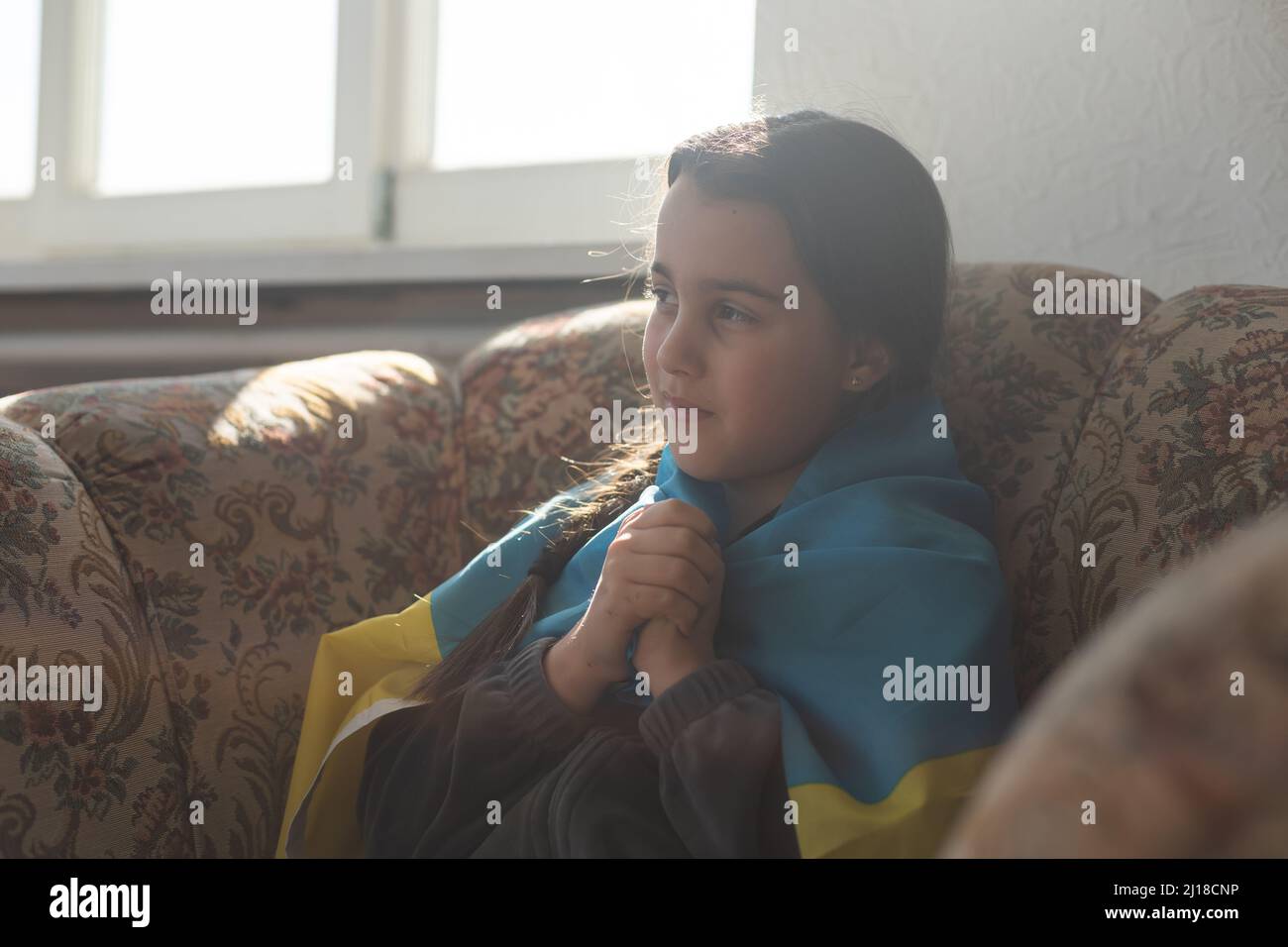 Pray for Ukraine. Child with Ukrainian flag. Little girl waving ...