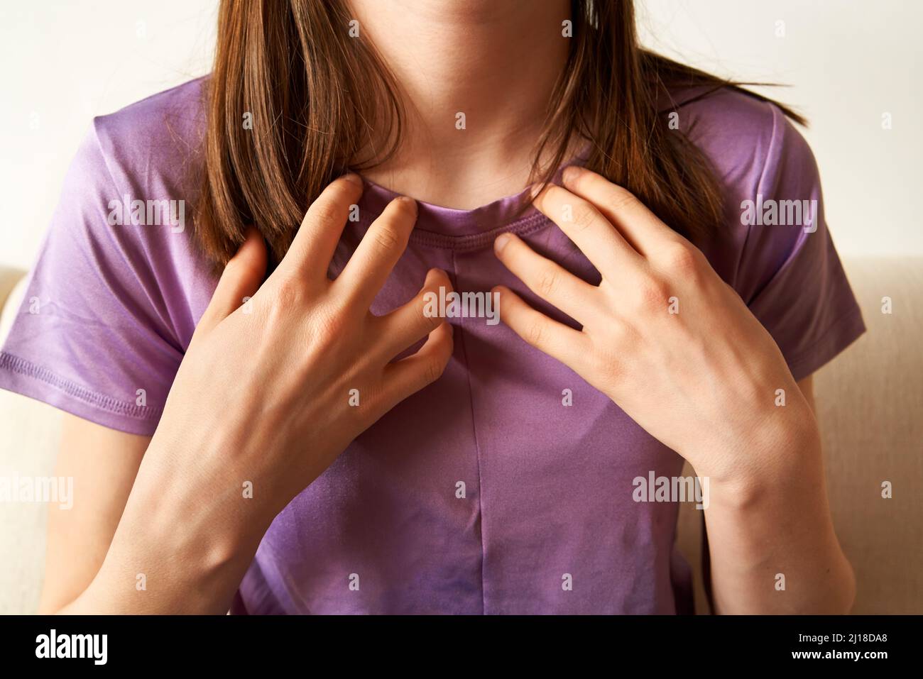 Teenage girl practicing EFT or emotional freedom technique - tapping on ...