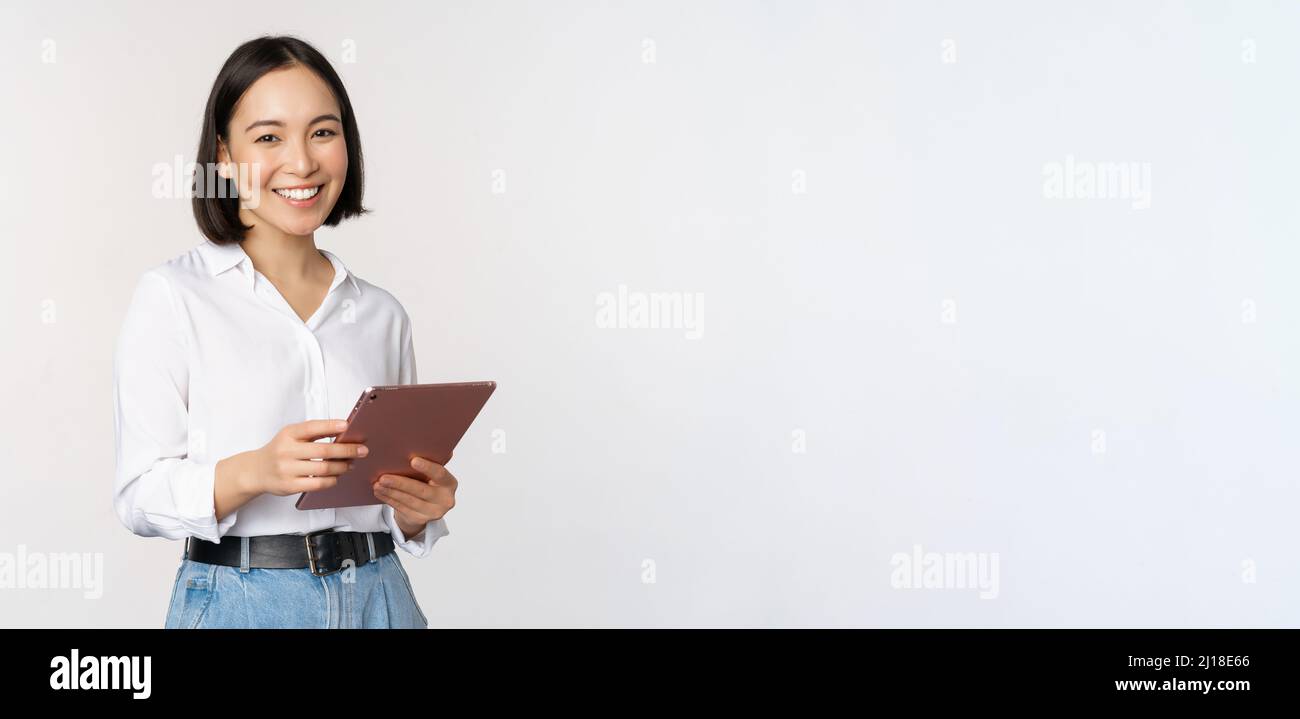 Image of young ceo manager, korean working woman holding tablet and ...