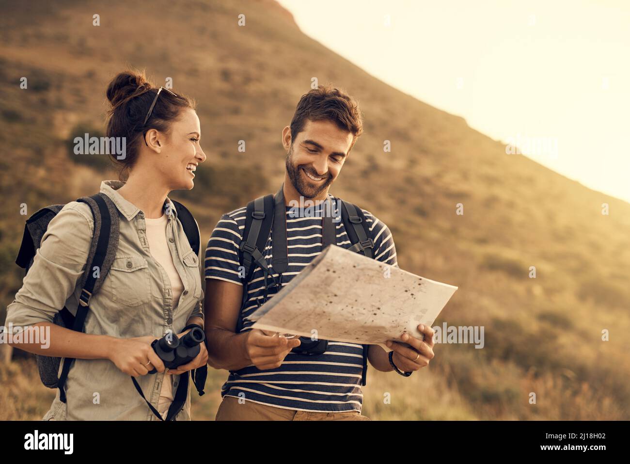 Do you even understand maps, babe. Shot of a couple looking at a map ...