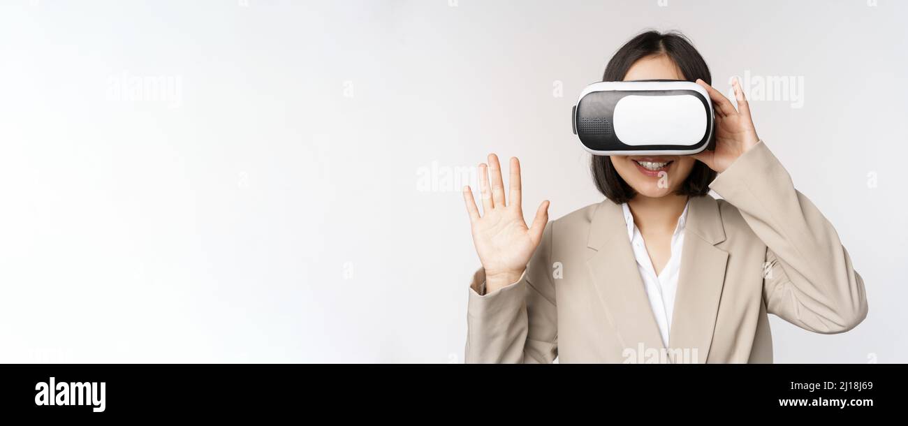 Meeting in vr chat. Asian businesswoman in virtual reality glasses ...