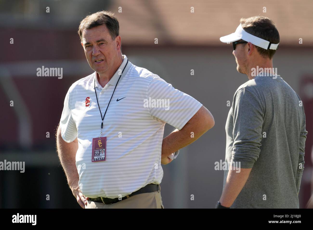 Southern California Trojans athletic director Mike Bohn (left) talks ...