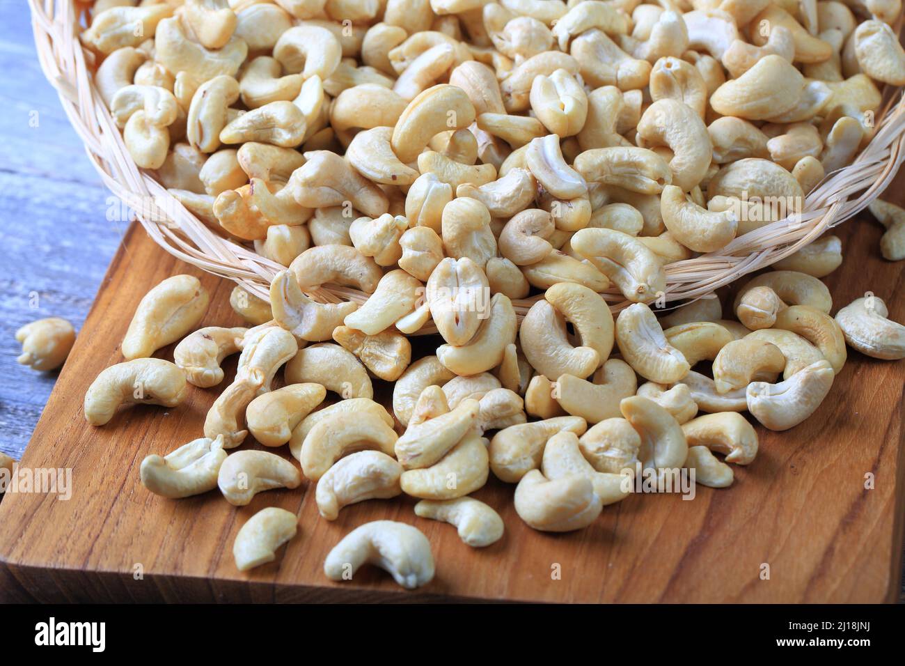 Cashew on wooden cutting board Stock Photo - Alamy
