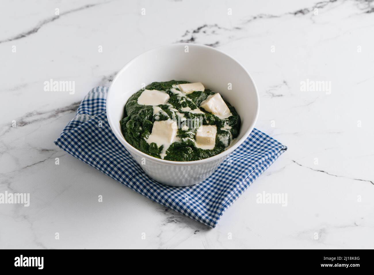 Palak Paneer Curry or spinach cheese in a dish isolated on napkin side ...