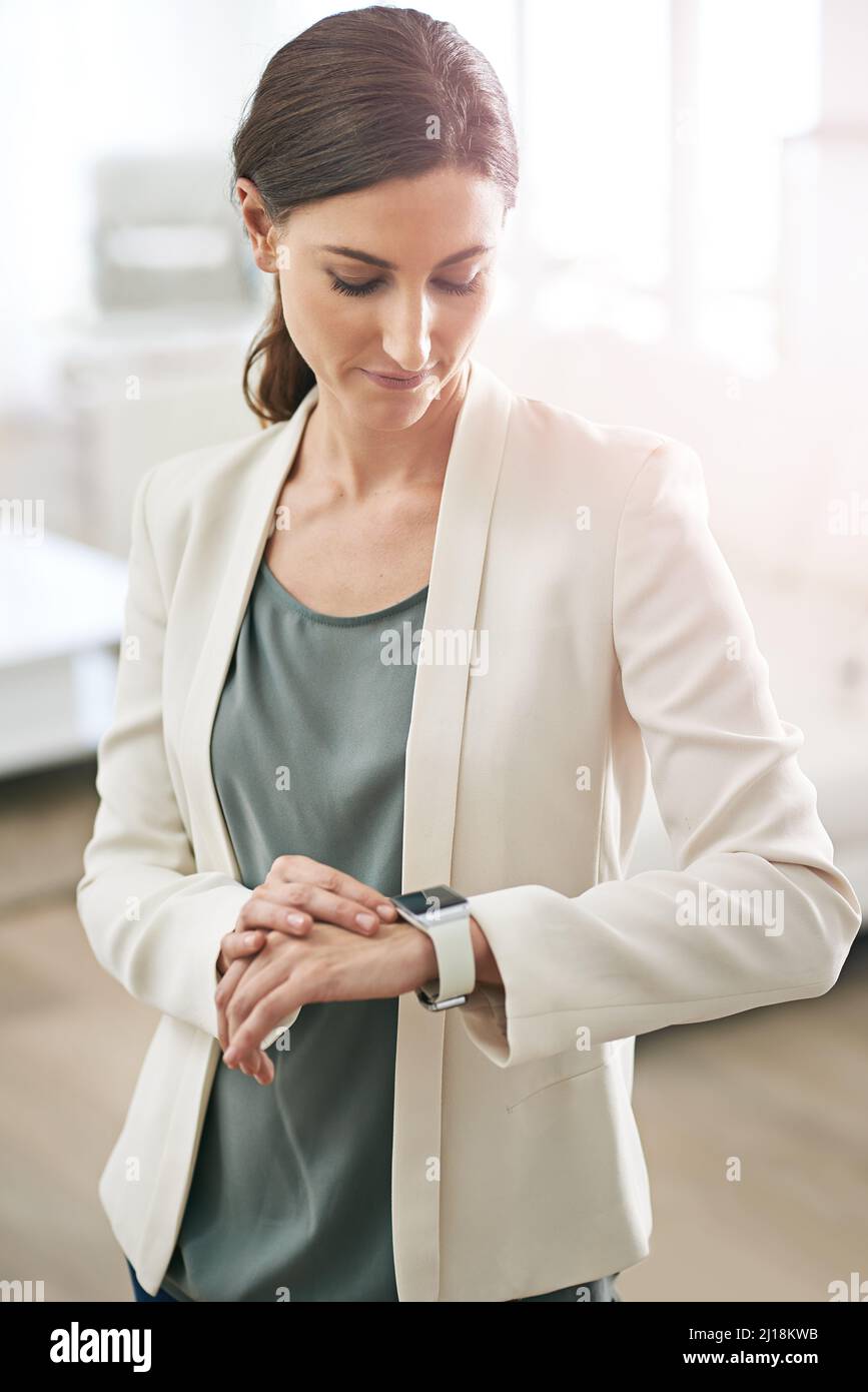 Smart watches for smart businesswomen. Shot of a young businesswoman ...