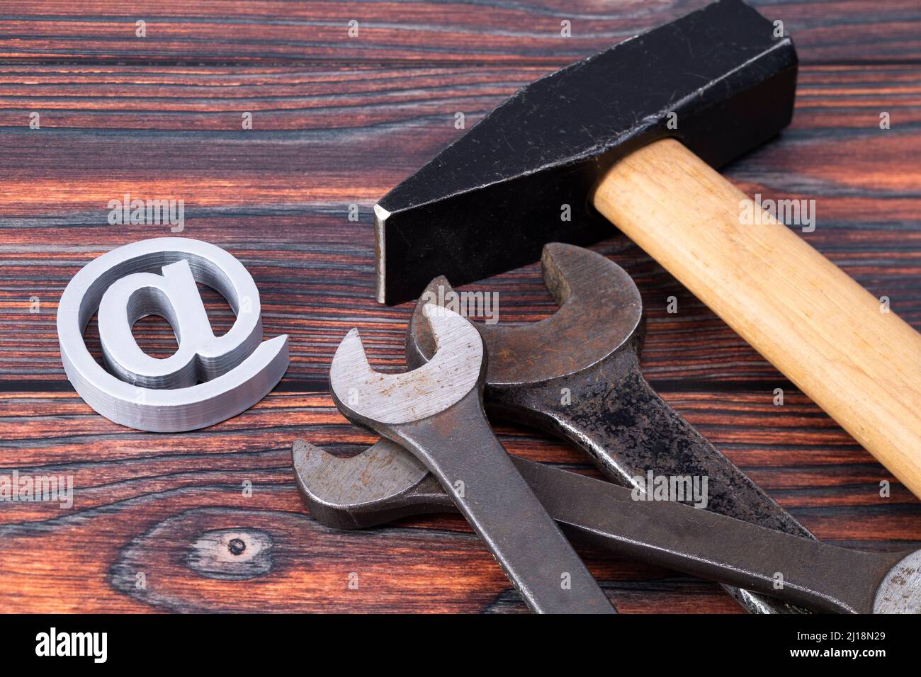 The photo shows an add icon with various tools on a wooden plate Stock ...