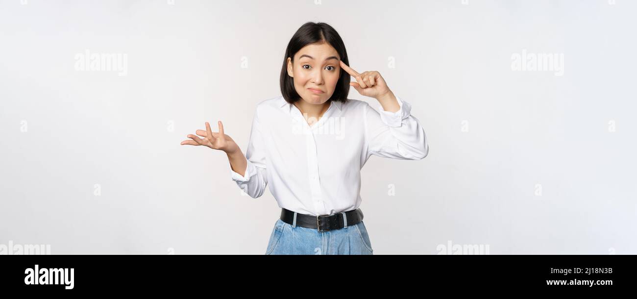 Are you insane. Portrait of frustrated young asian woman, roll finger ...