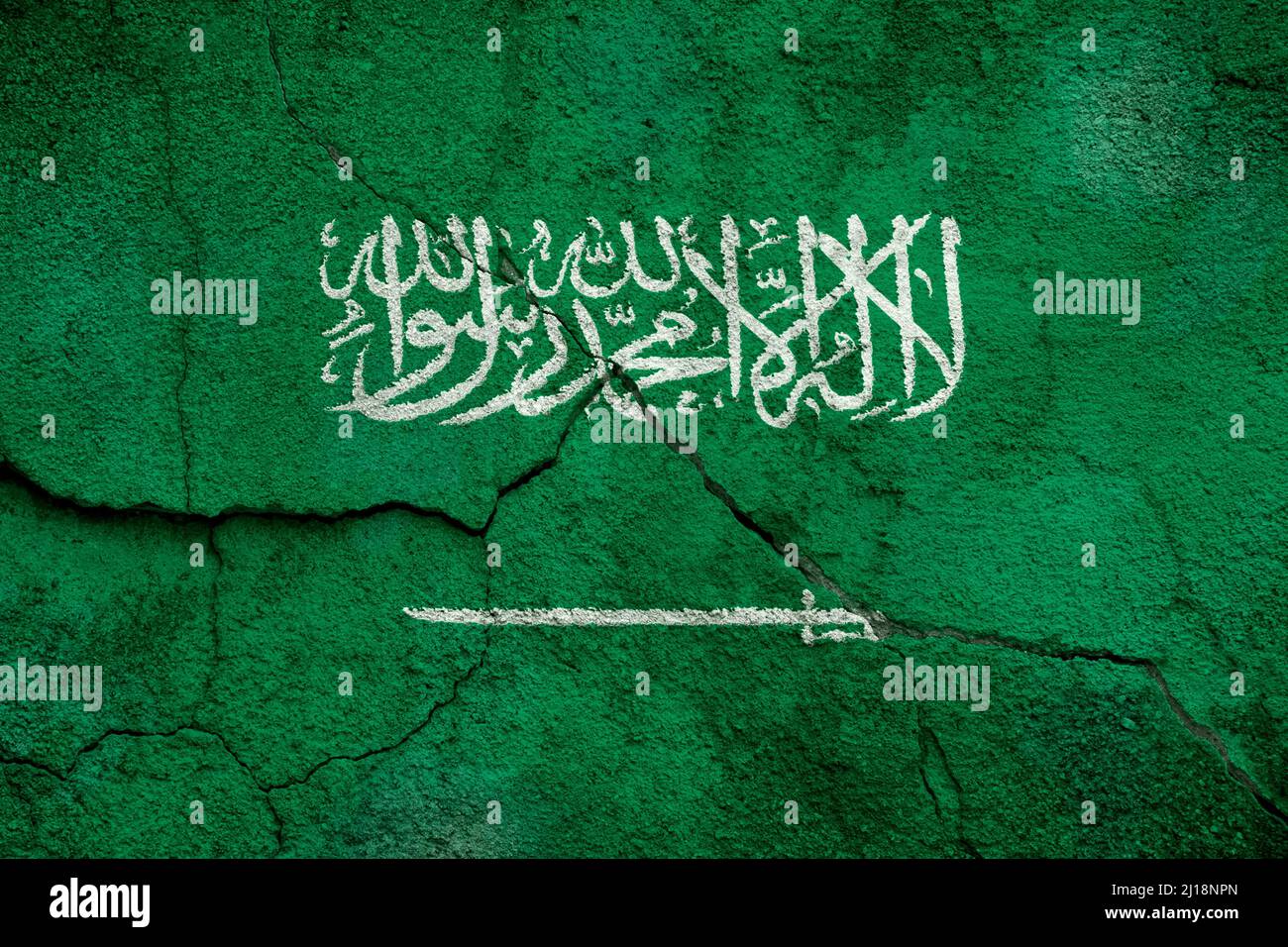Full frame photo of a weathered flag of Saudi Arabia painted on a ...