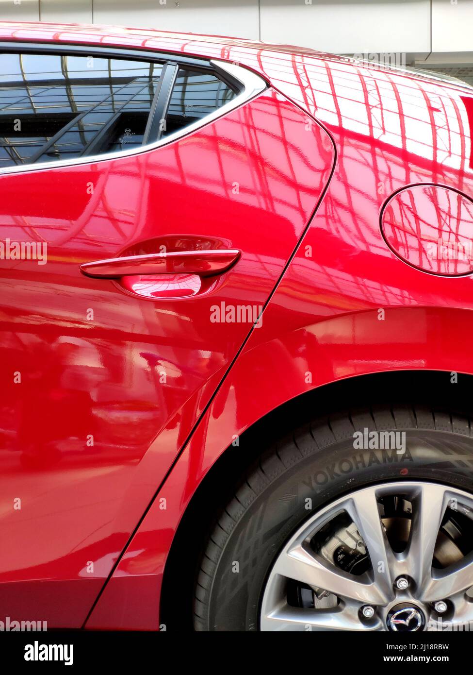 New Red Mazda 3 displayed at auto show Stock Photo - Alamy