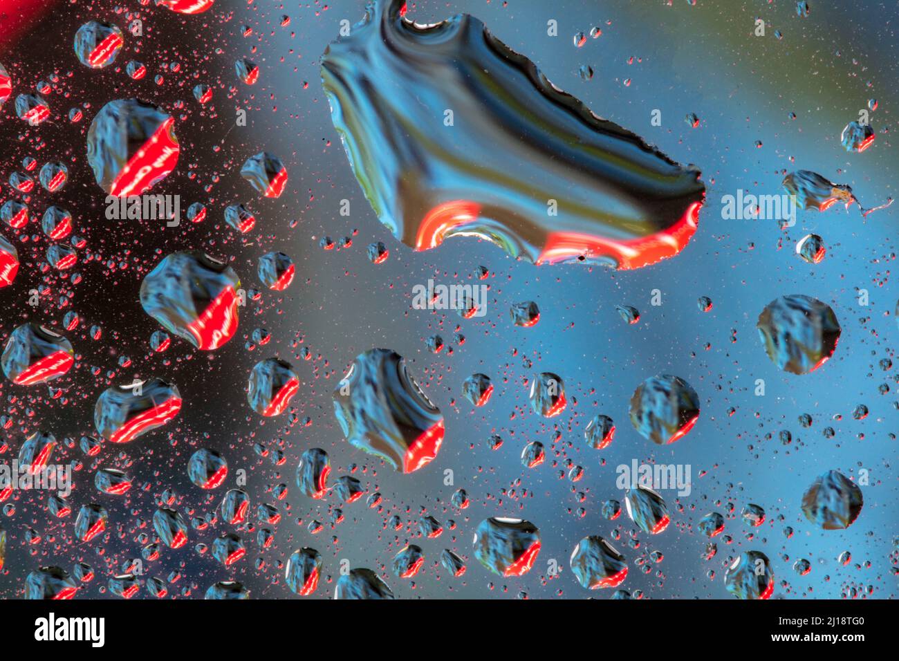 Abstract irregular water drops macro showing reflected colours Stock ...