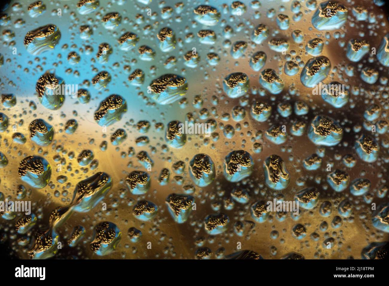 Abstract irregular water drops macro showing reflected colours Stock ...