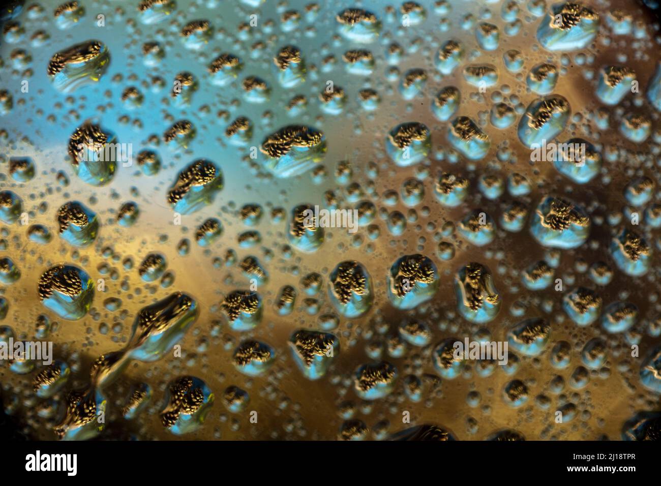 Abstract irregular water drops macro showing reflected colours Stock ...