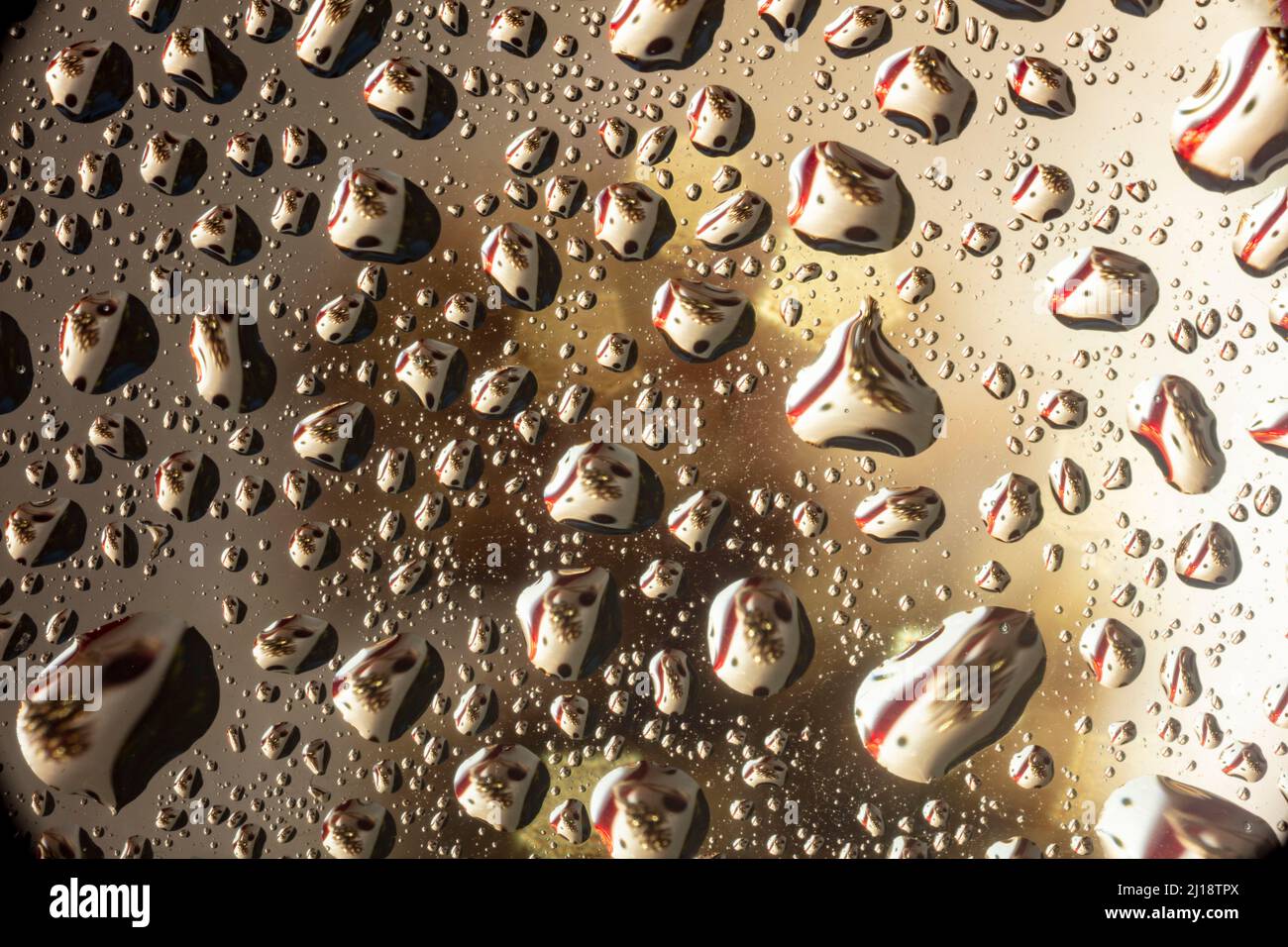 Abstract irregular water drops macro showing reflected colours Stock ...