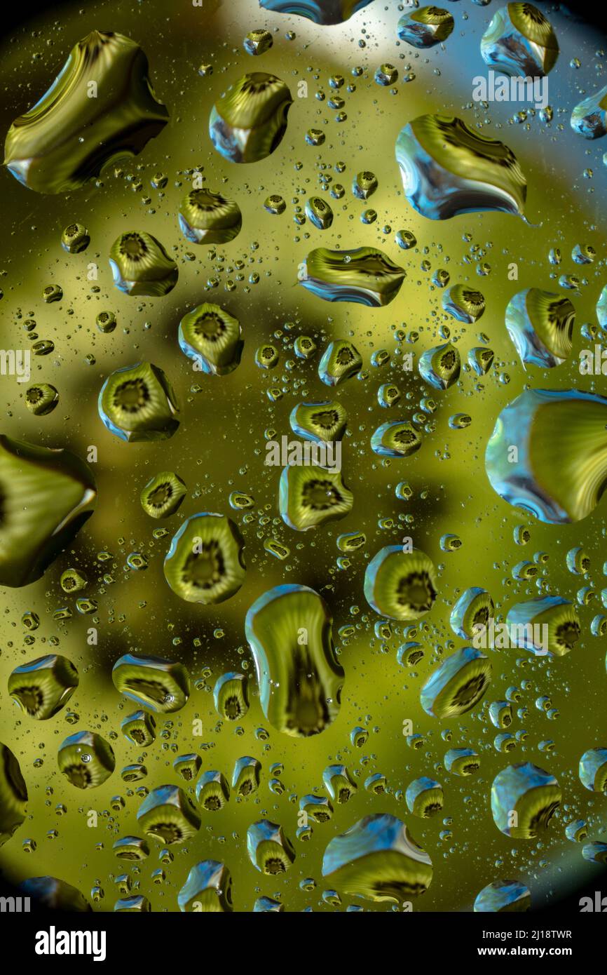 Abstract irregular water drops macro showing reflected colours Stock ...
