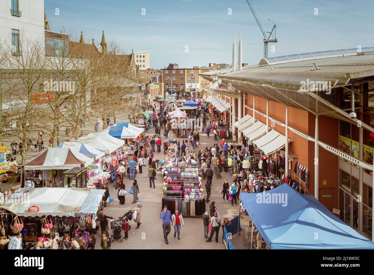 Crowds of shoppers enjoying looking around the stalls at Birmingham Rag ...
