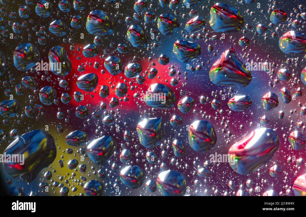 Abstract irregular water drops macro showing reflected colours Stock ...