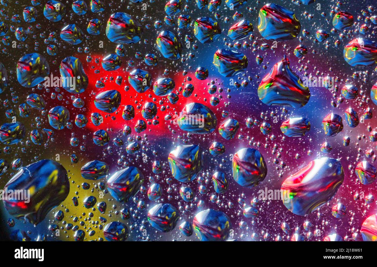 Abstract irregular water drops macro showing reflected colours Stock ...