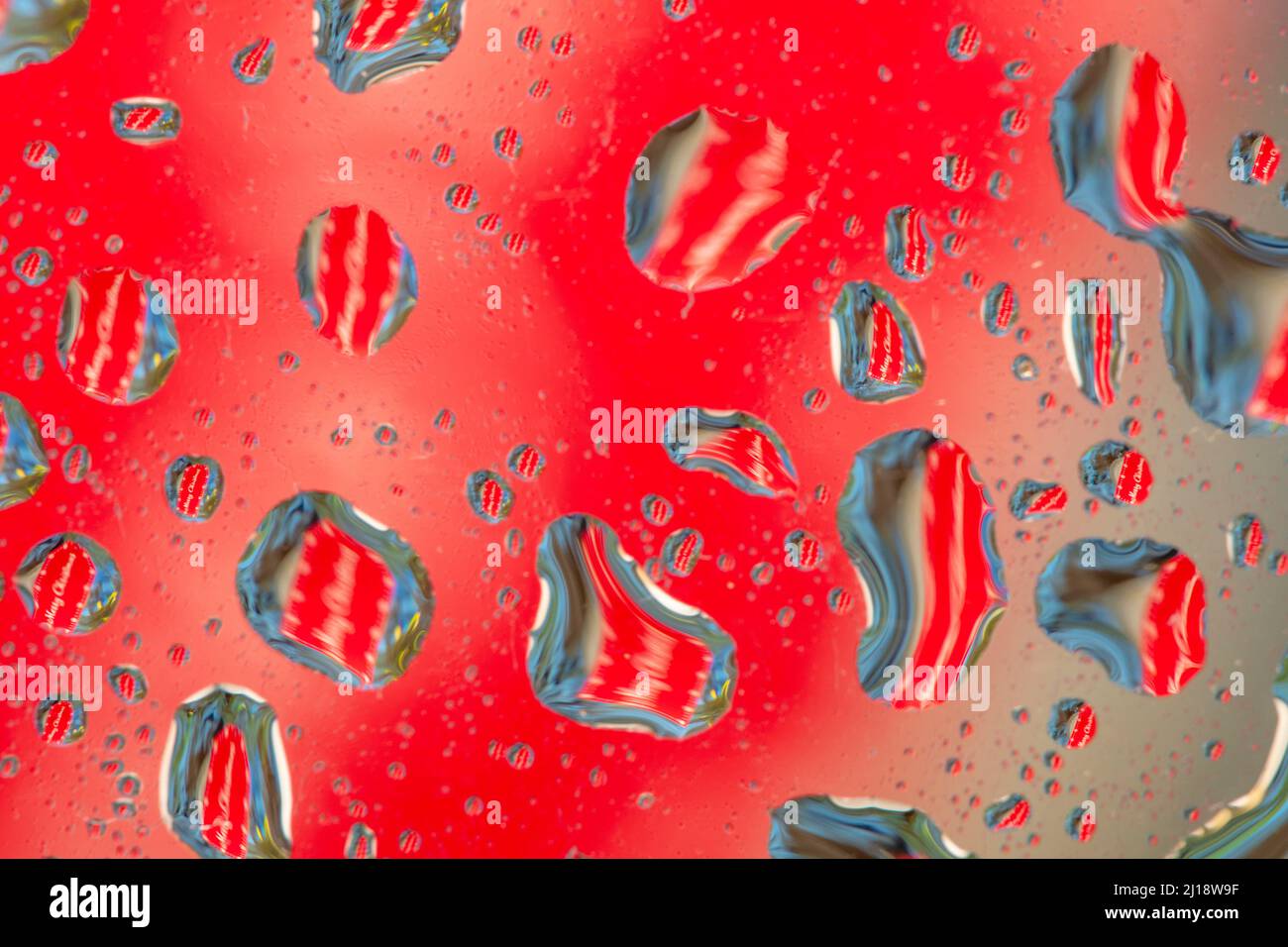 Abstract irregular water drops macro showing reflected colours Stock ...