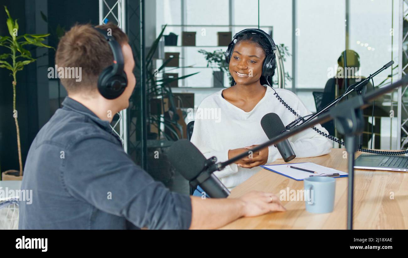 Female Host Talking to a Guest Friend on a Podcast Radio Station in the ...