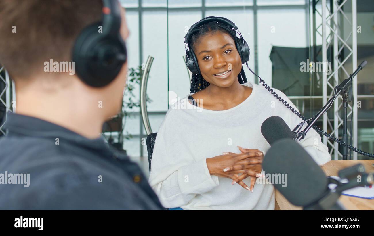 Female Host Talking to a Guest Friend on a Podcast Radio Station in the ...