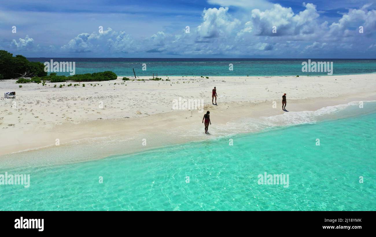 A group of people on the beach of Fulhadhoo Island, The Maldives Stock ...