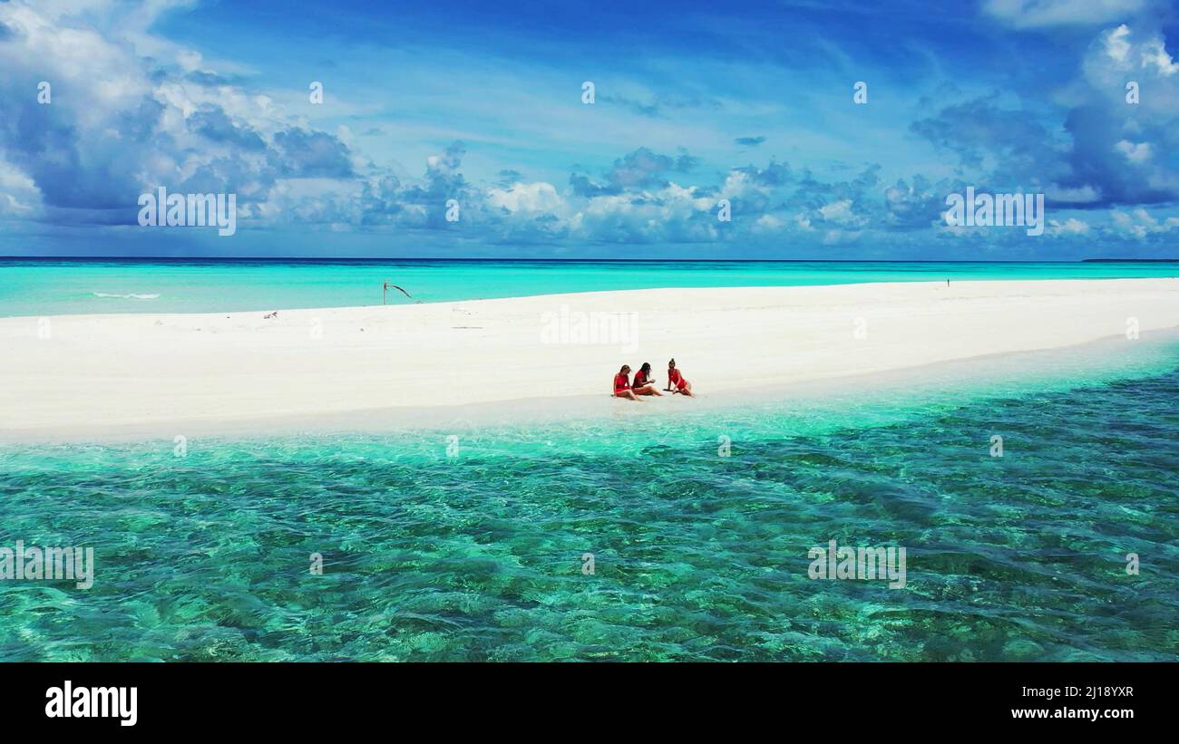 A group of women on the beach of Fulhadhoo Island, The Maldives Stock ...