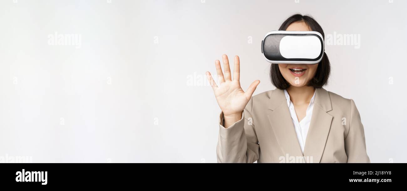 Meeting in vr chat. Asian businesswoman in virtual reality glasses ...