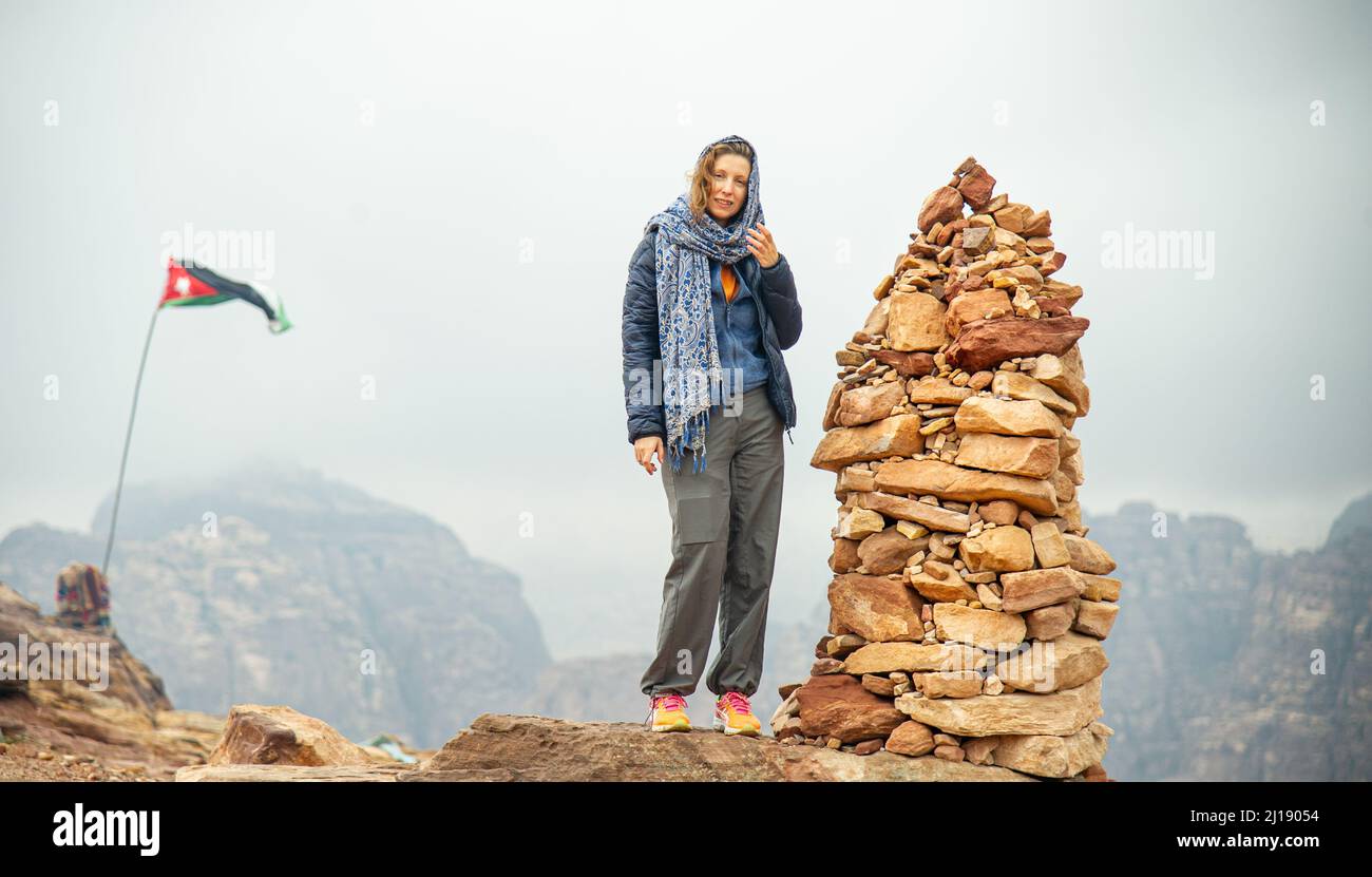 Attractive female tourist poses in Petra Jordan in various places where ...