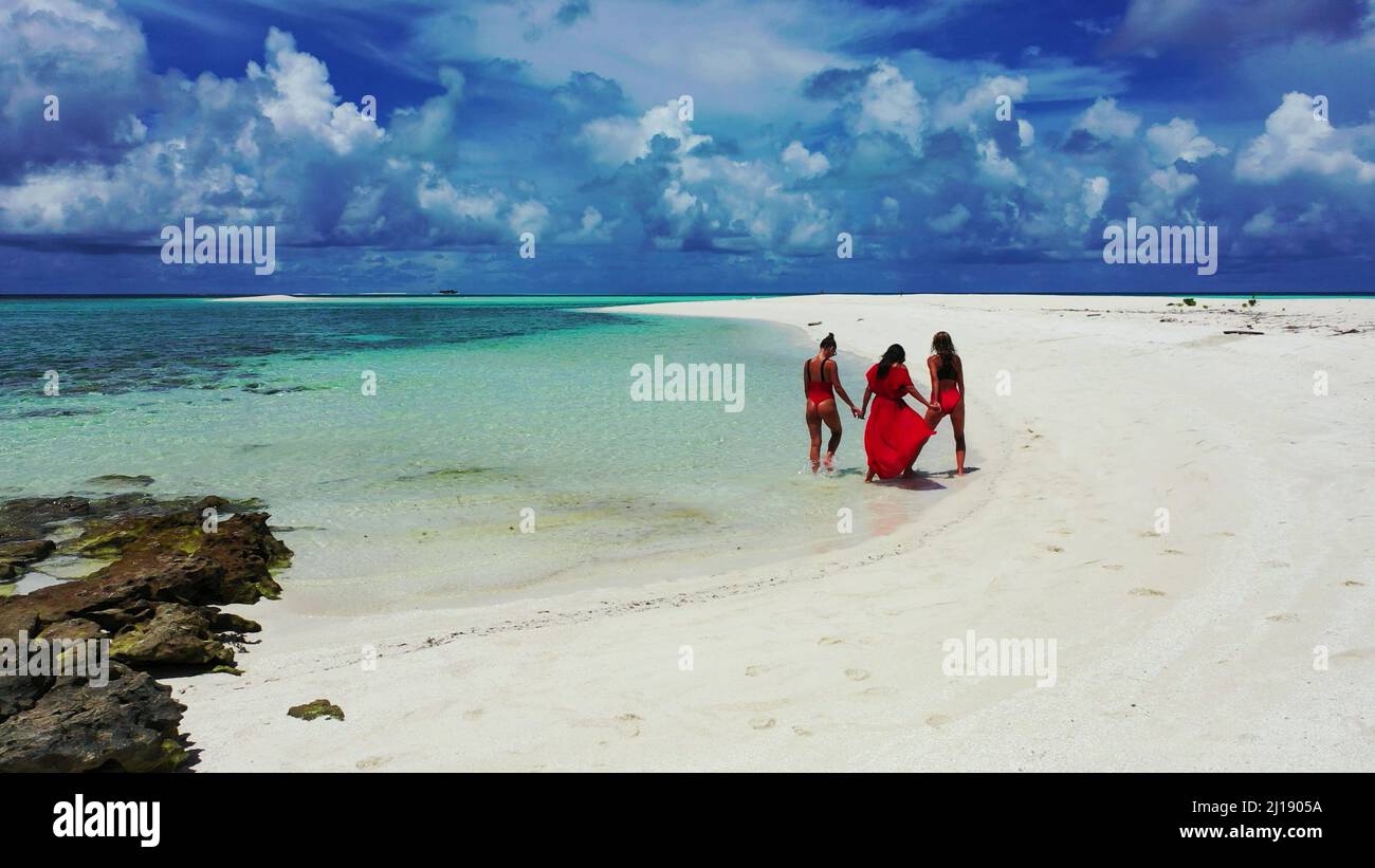 A group of women on the beach of Fulhadhoo Island, The Maldives Stock ...