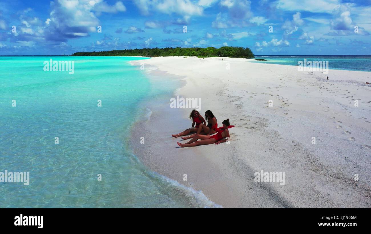 A group of women on the beach of Fulhadhoo Island, The Maldives Stock ...