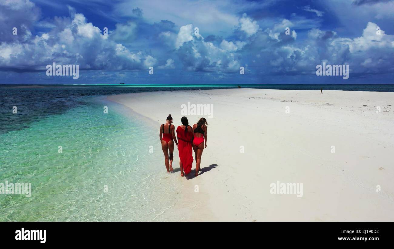 A group of women on the beach of Fulhadhoo Island, The Maldives Stock ...