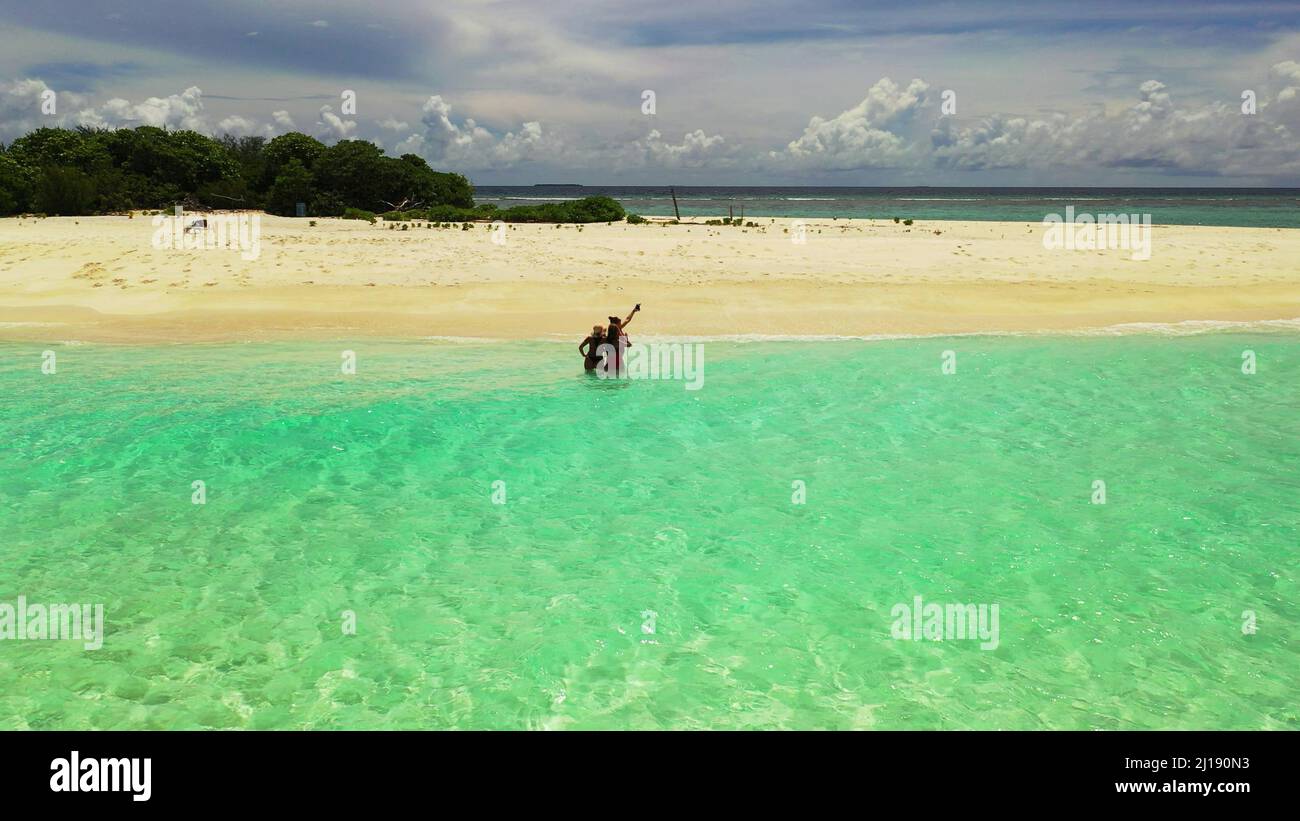The Caucasian women from Russia on the beach in Fulhadhoo Island, the ...