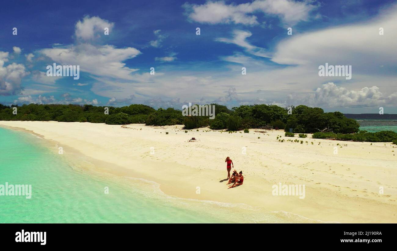 A group of women on the beach of Fulhadhoo Island, The Maldives Stock ...