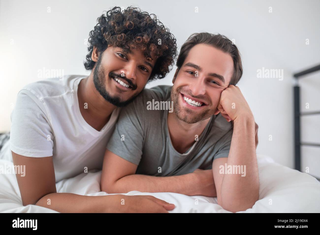 Affectionate Indian man embracing his Caucasian boyfriend Stock Photo ...