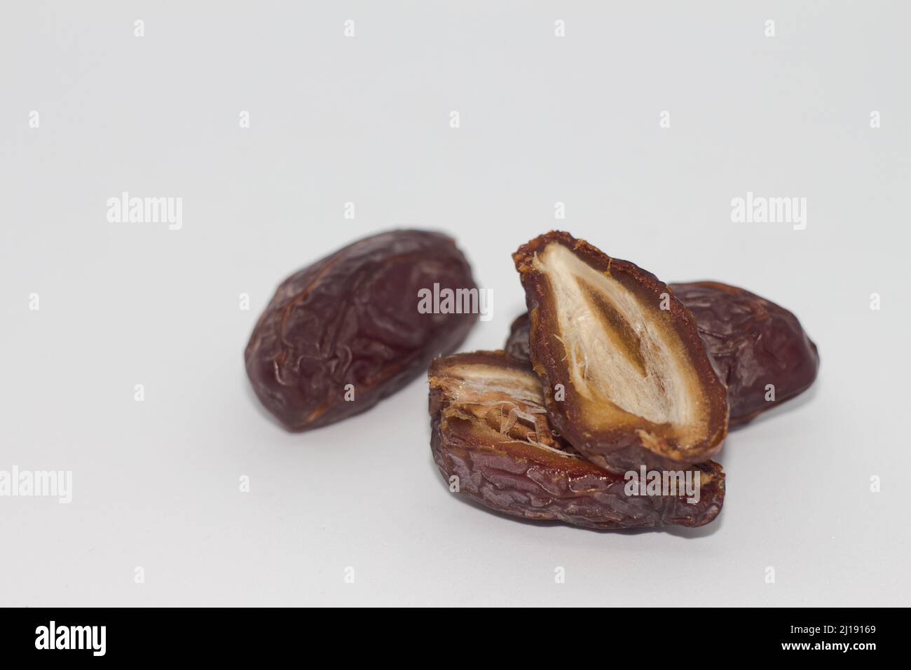 Dried split date. Dried dates isolated on white background. Ramadan ...