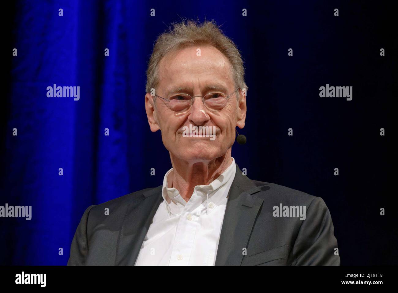 Cologne, Germany. 23rd Mar, 2022. Author Bernhard Schlink sits on stage ...