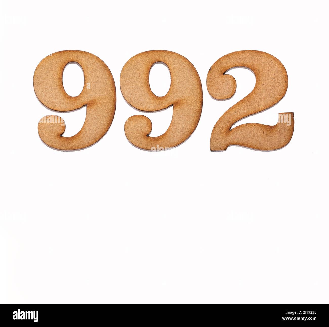 Number 992 - Piece of wood isolated on white background Stock Photo - Alamy