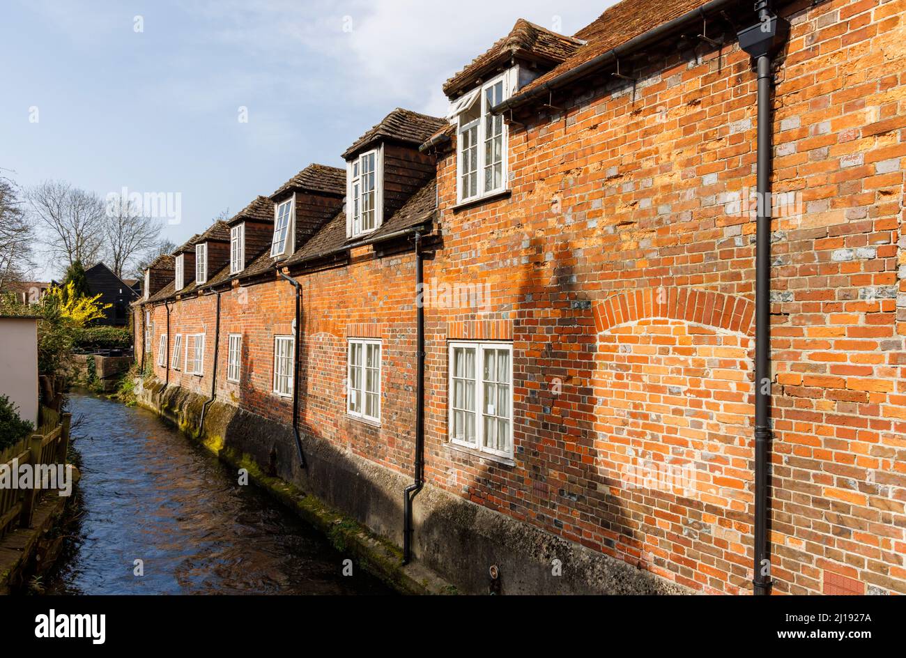 Historic red brick cottages with dormer and infilled windows backing on ...