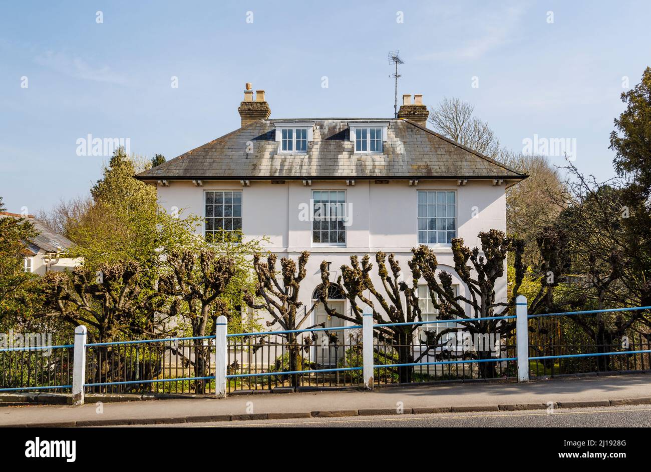 A classically proportioned symmetrical Georgian style town house with a ...
