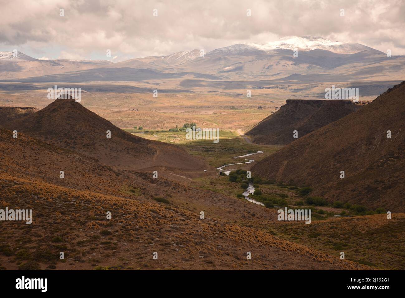 A beautiful view of a river between small mountains and hills in a ...