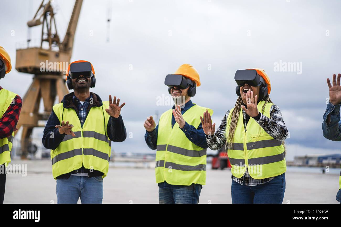 Multiracial workers using virtual reality headsets at Freight Terminal ...