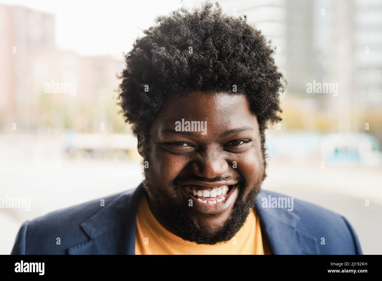 Happy african man smiling on camera outdoor - Focus on face Stock Photo ...